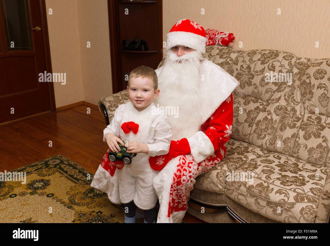 Santa Claus came to visit and brought the boy a gift Stock Photo - Alamy