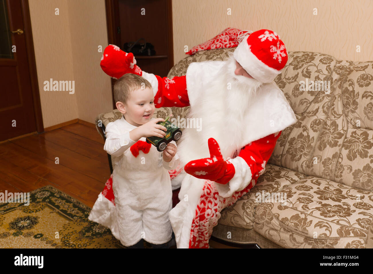 Santa Claus came to visit and brought the boy a gift Stock Photo - Alamy