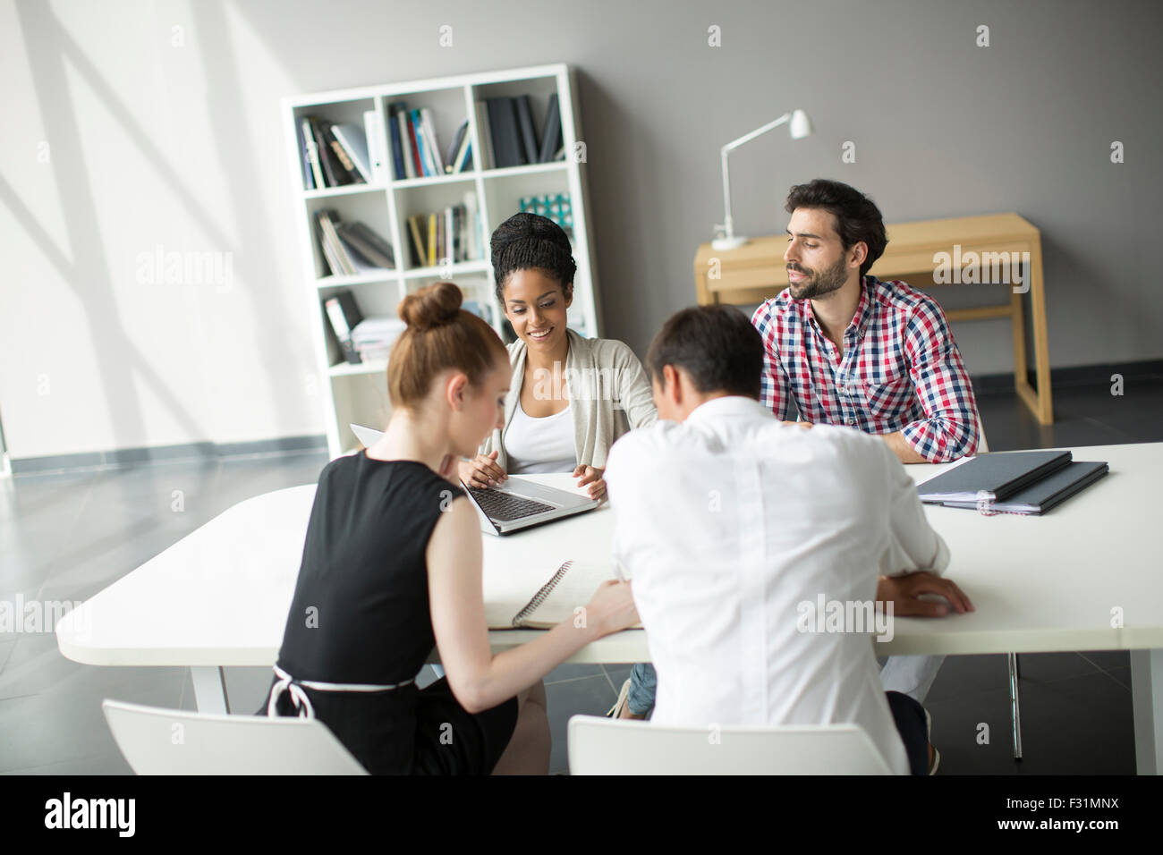 Young people in the office Stock Photo - Alamy