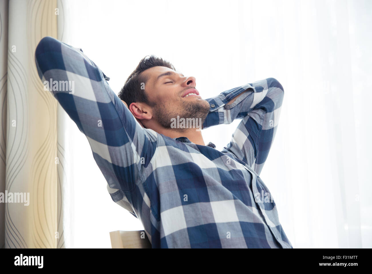 Man resting on chair in hi-res stock photography and images - Alamy