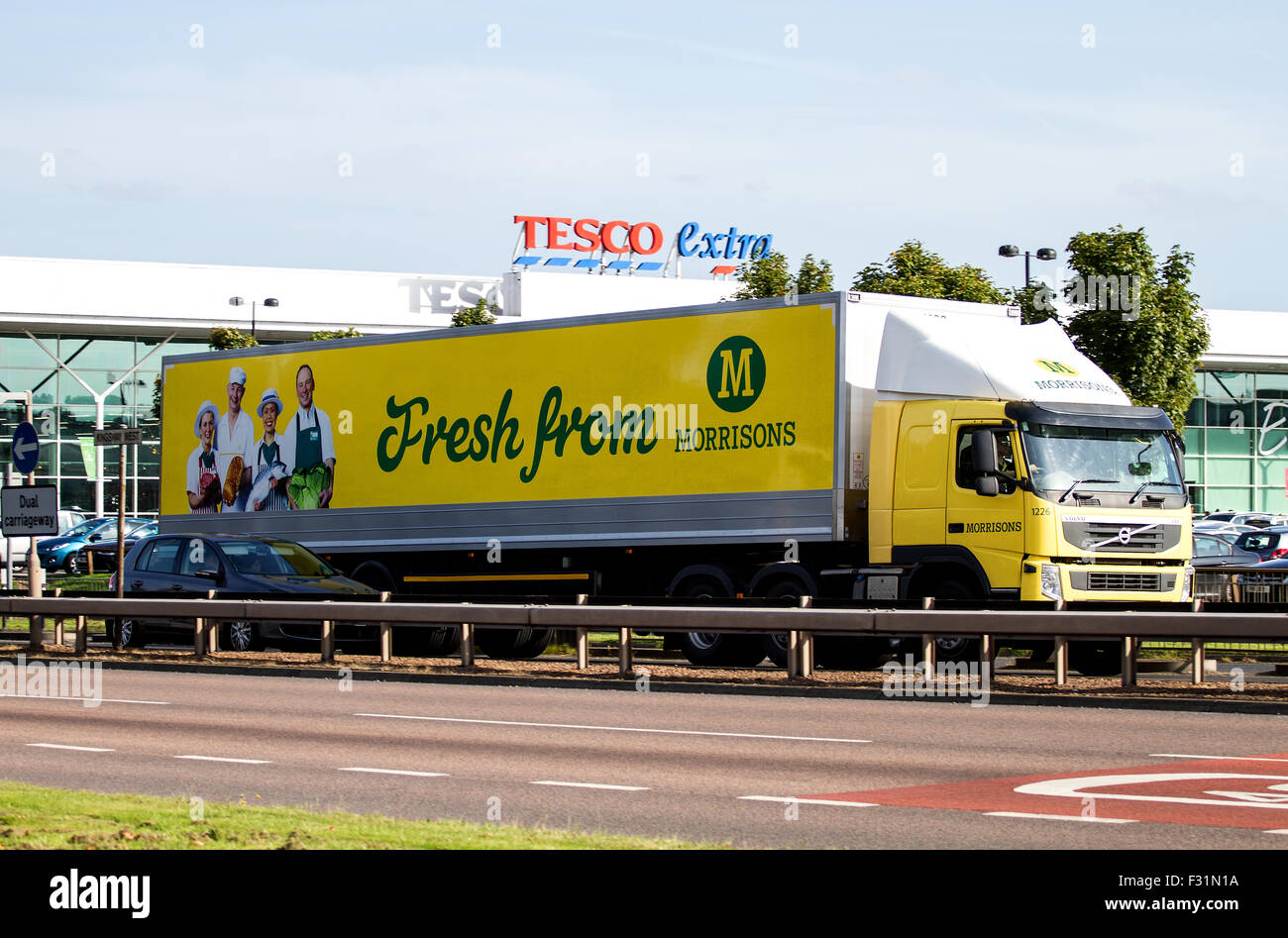 Morrisons articulated lorry travelling past the Tesco Extra supermarket ...