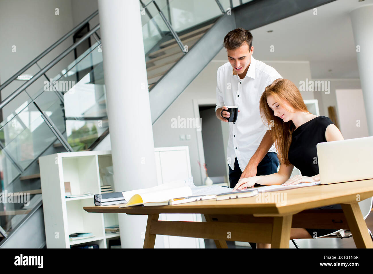 Young people in the office Stock Photo - Alamy
