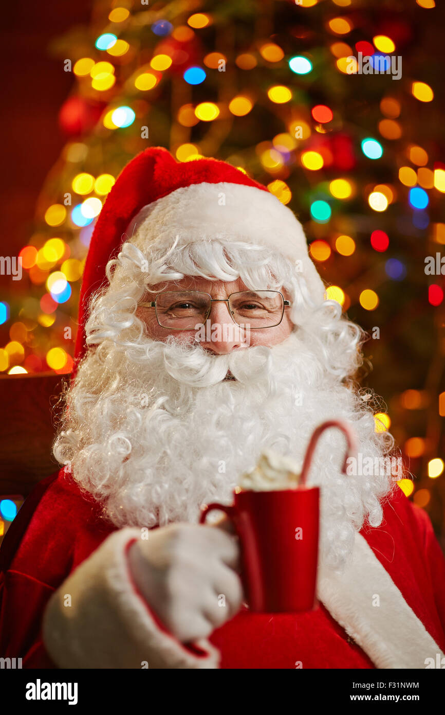 Santa claus holding red cup hi-res stock photography and images - Alamy