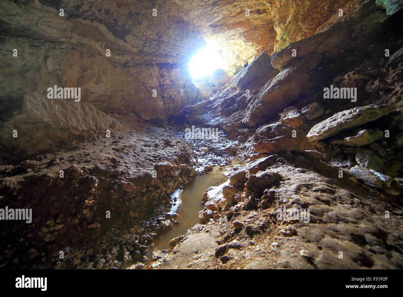 Cave exit interior underground light path tunnel dark Stock Photo - Alamy