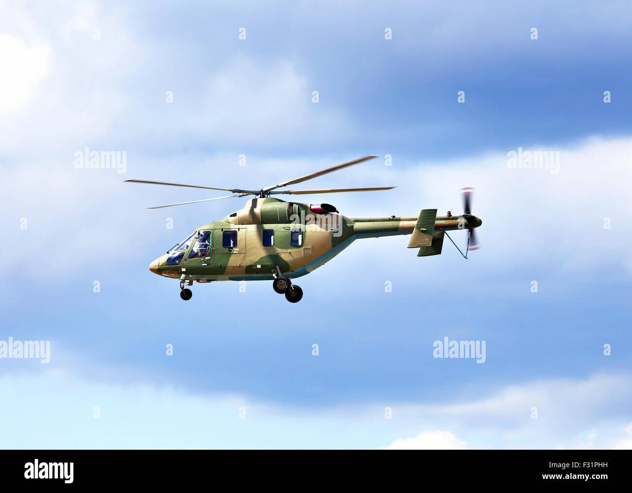 Modern russian military training helicopter "Ansat" flighing in sky ...