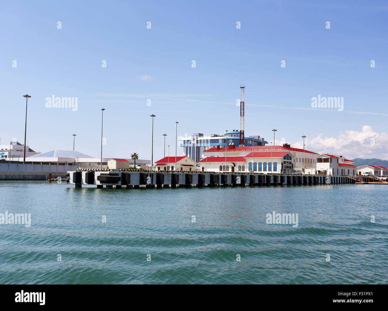 Port berth with adminisrative and technical buildings by the entrance ...