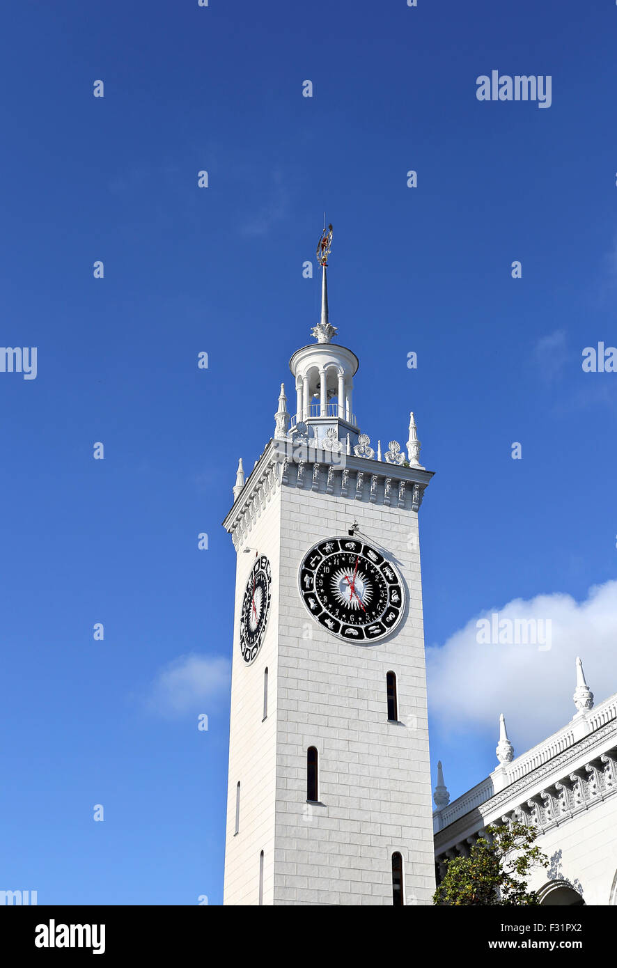 White tower with spire and clock with zodiac signs on the dial Stock ...
