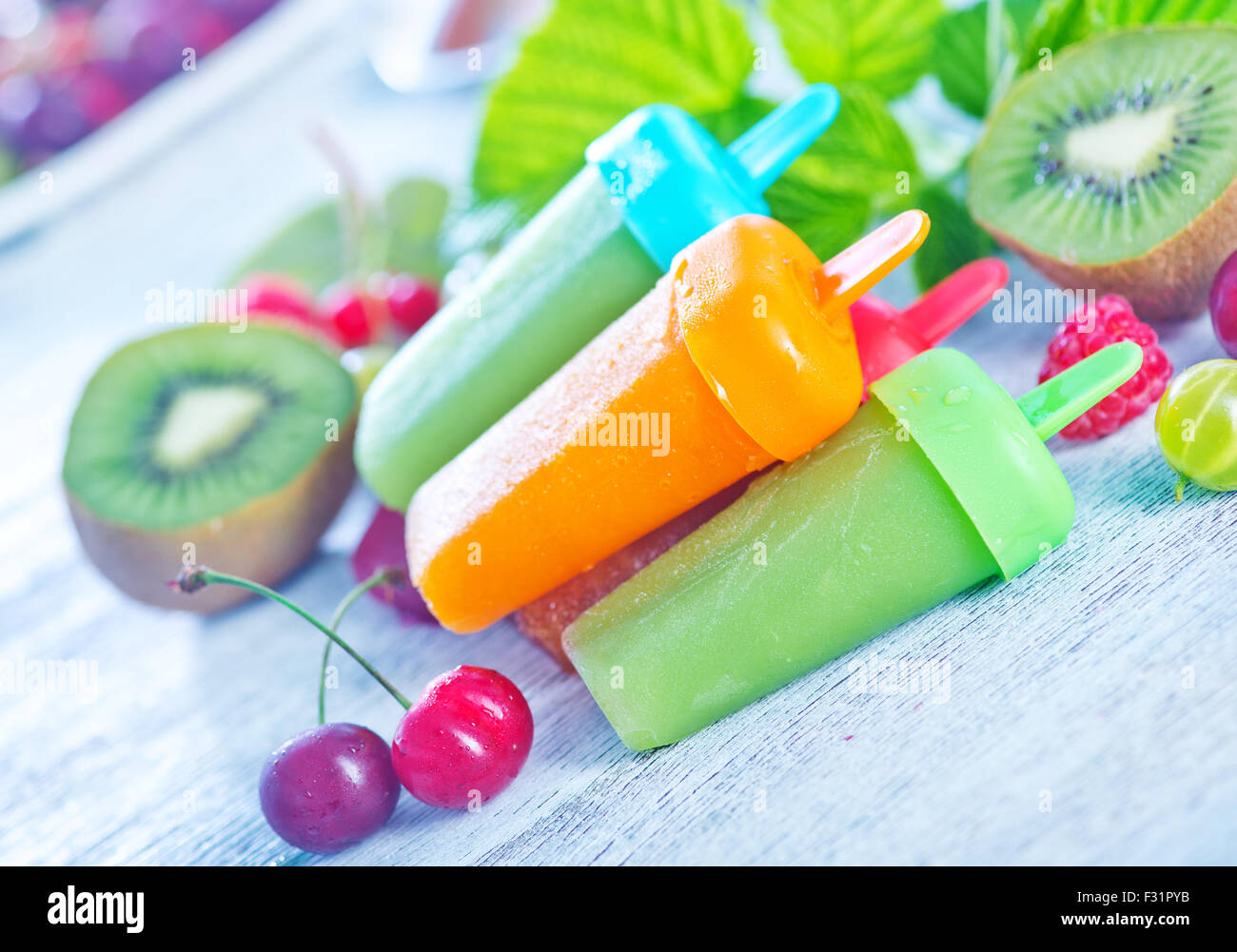 fruit ice cream on metal tray and on a table Stock Photo - Alamy