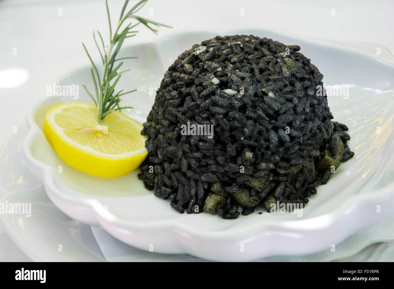 Black risotto squid on plate hi-res stock photography and images - Alamy