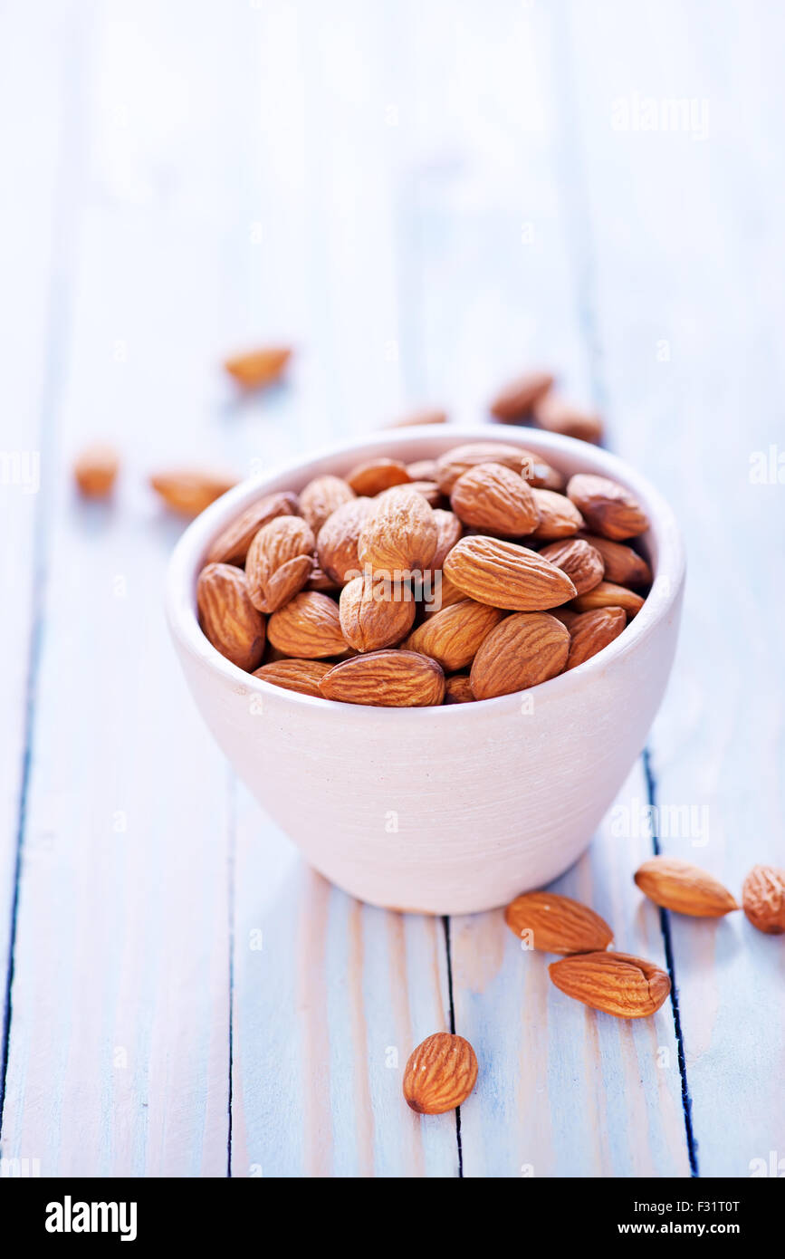 almond without shell on the wooden table Stock Photo - Alamy