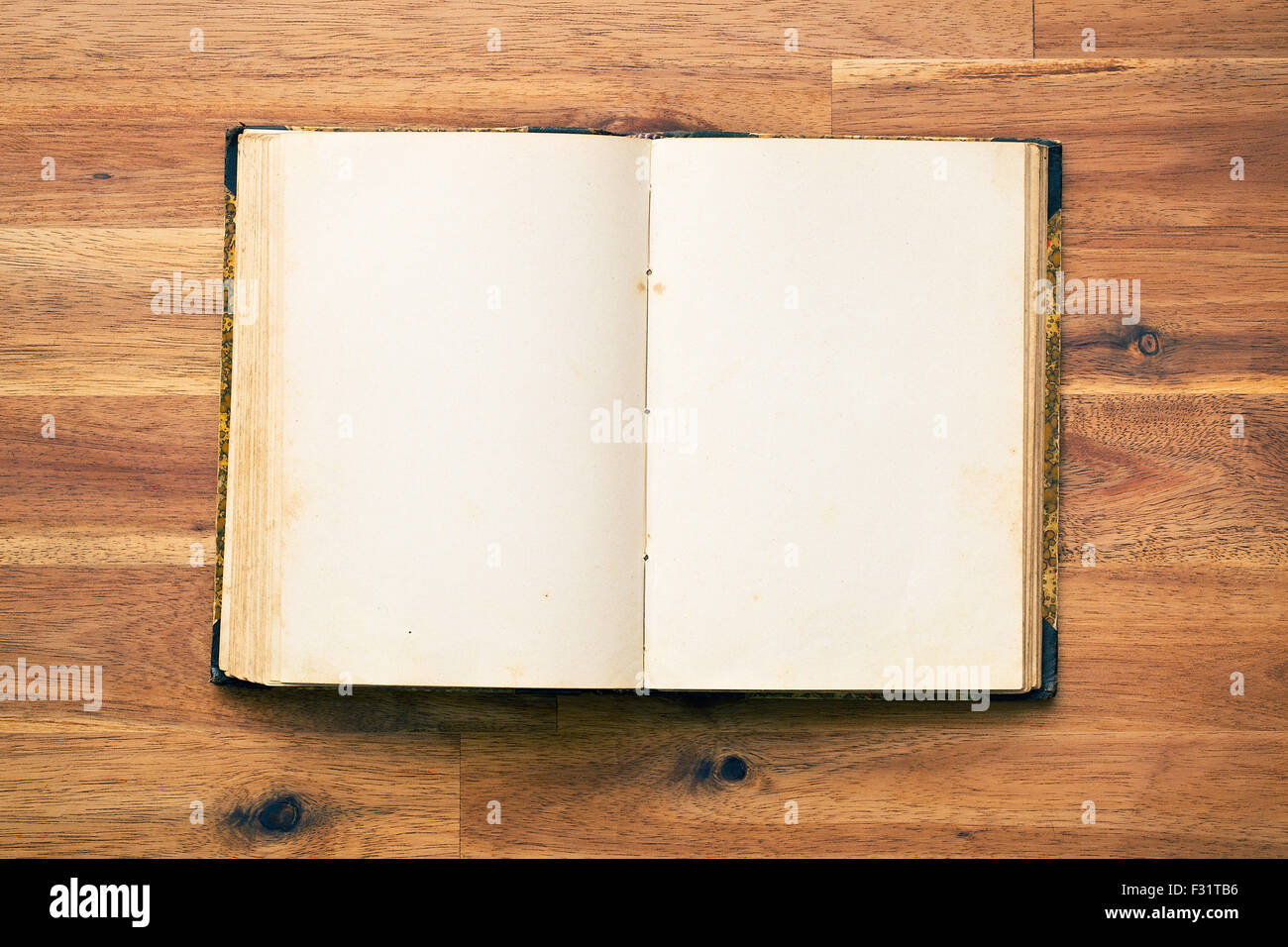 open old book on wooden desk Stock Photo - Alamy