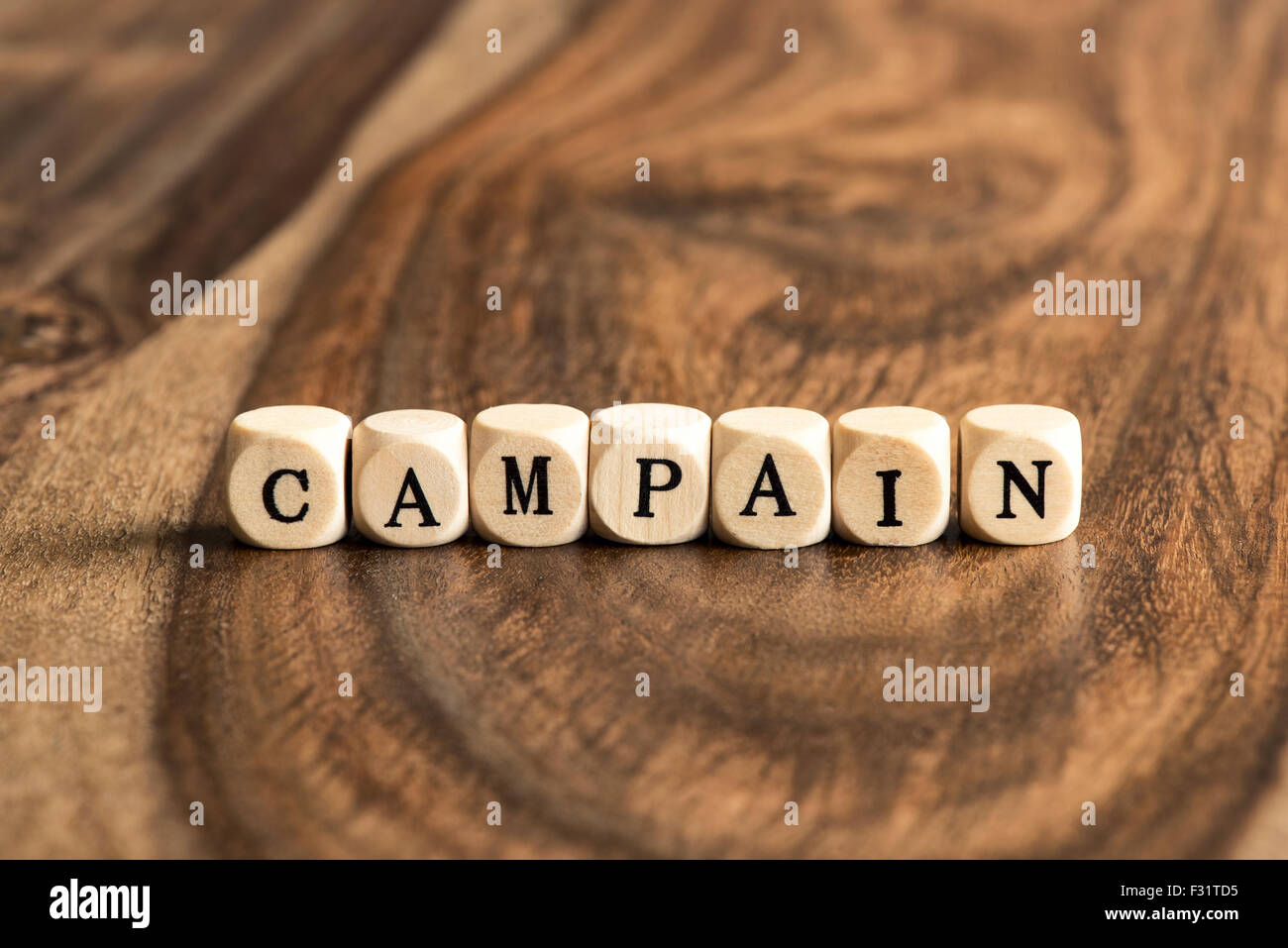 CAMPAIGN word background on wood blocks Stock Photo - Alamy