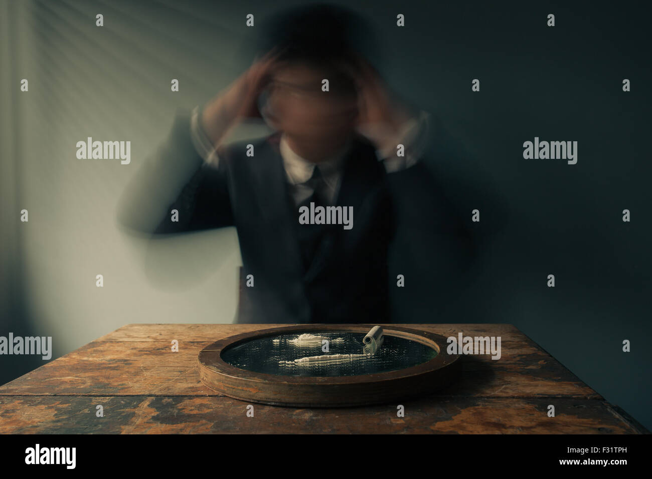 Young businessman is shaking after getting high on cocaine Stock Photo ...