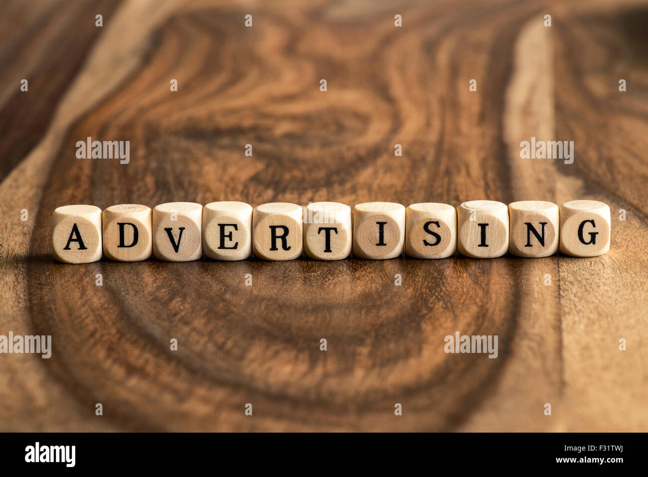 ADVERTISING word background on wood blocks Stock Photo - Alamy