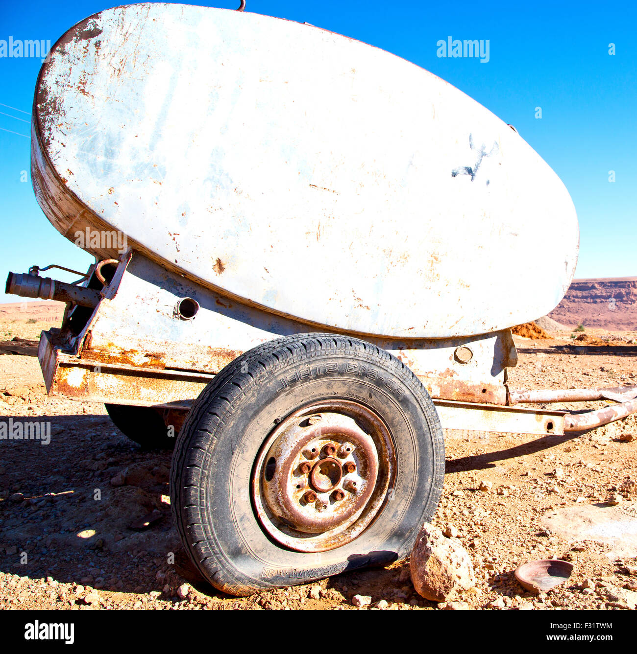 water tank in morocco africa land gray metal weel and arid Stock Photo ...