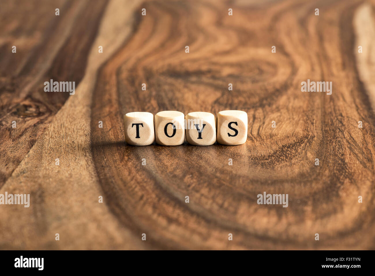 TOYS word background on wood blocks Stock Photo - Alamy