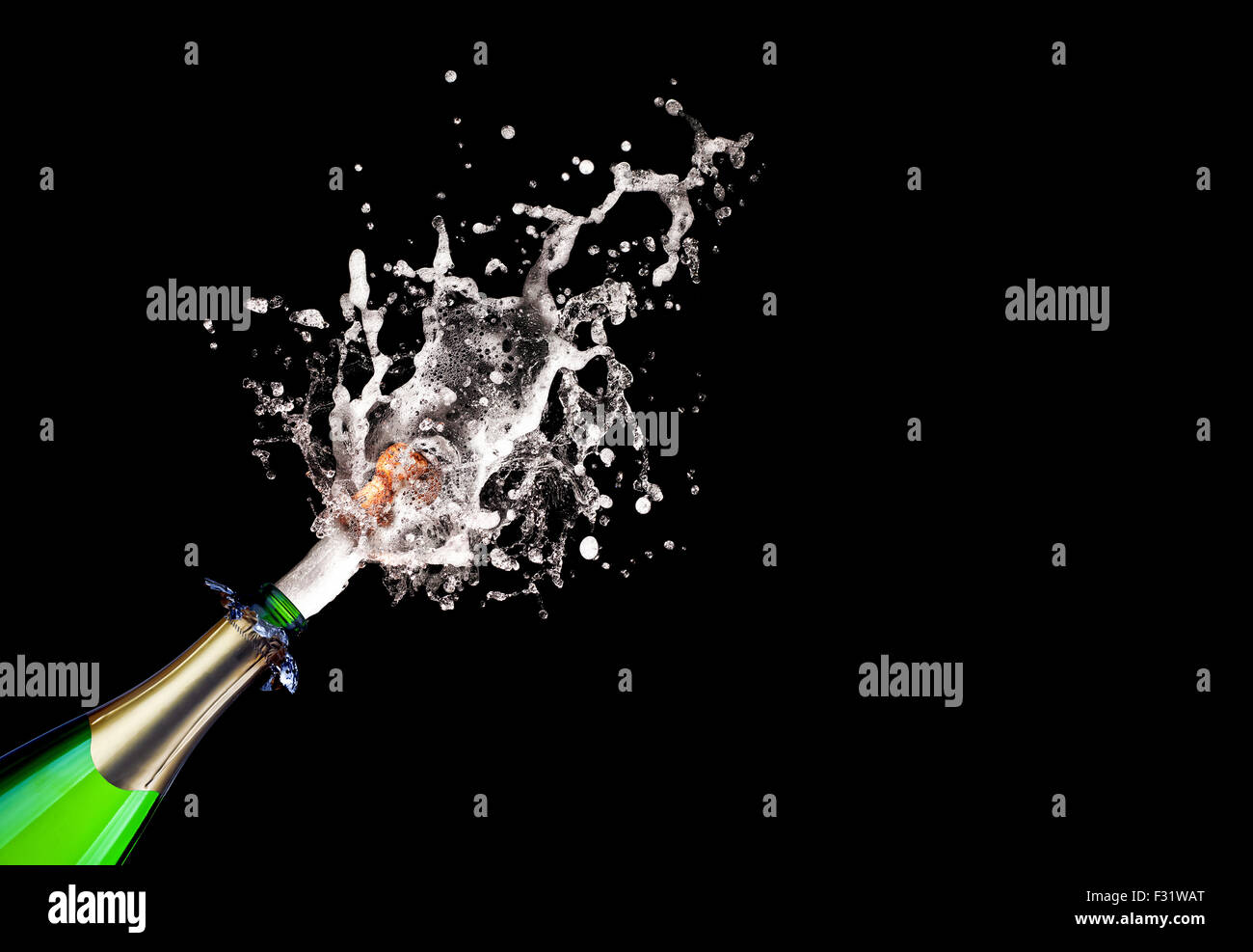 detail of popping champagne on black background Stock Photo - Alamy