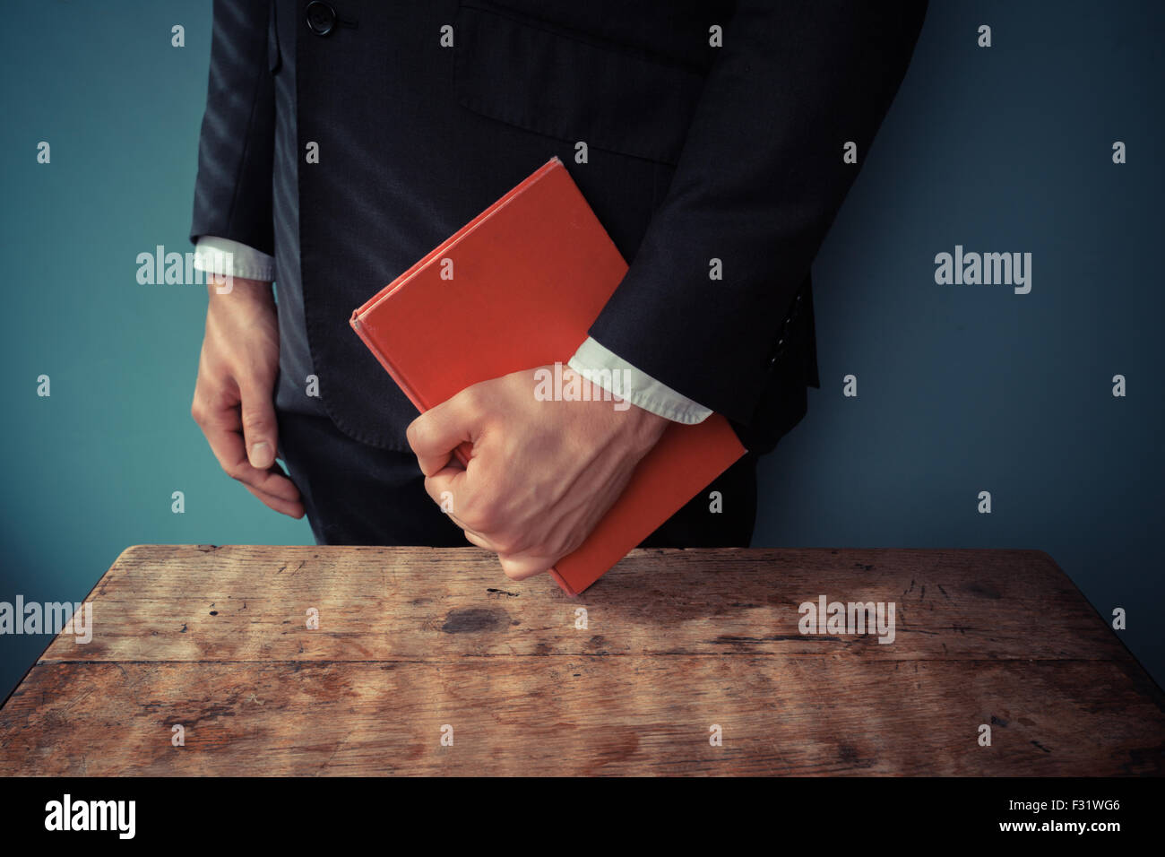 Man standing behind table hi-res stock photography and images - Alamy