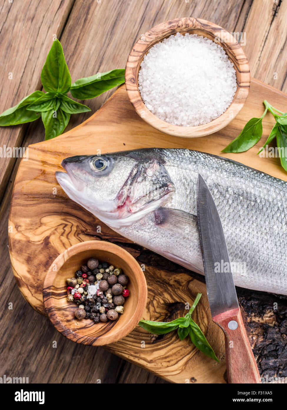Seabass fish on the graphite board Stock Photo - Alamy
