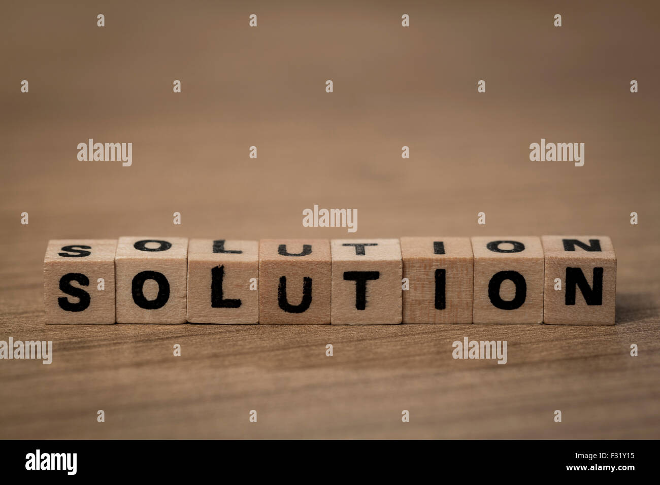 Solution written in wooden cubes on a desk Stock Photo - Alamy
