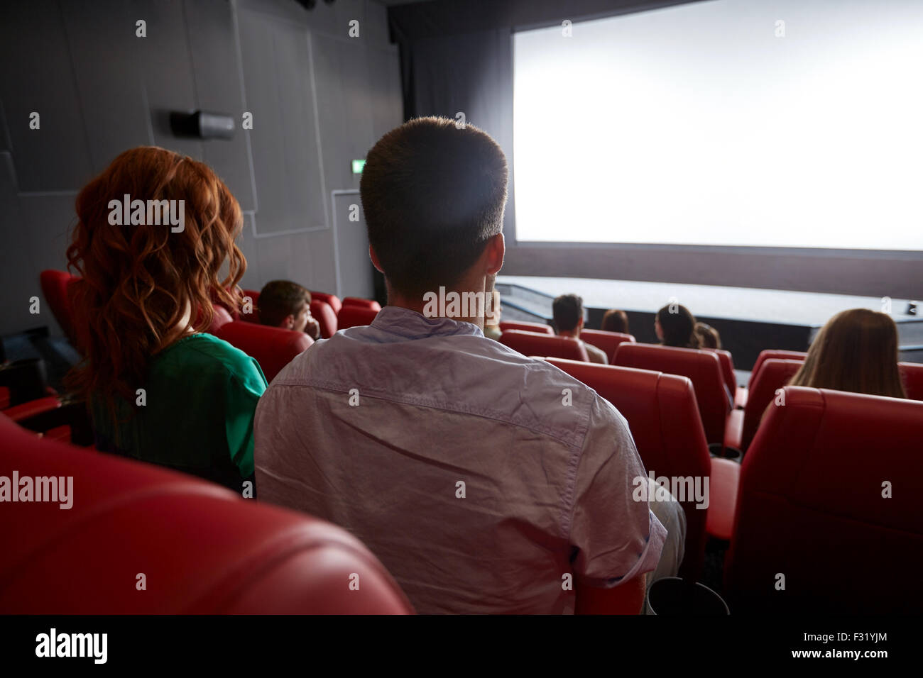 Movie theater audience rear view hi-res stock photography and images ...