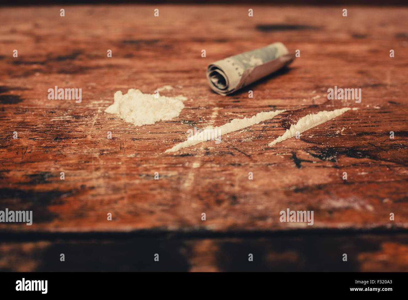 Cocaine and banknote arranged on table Stock Photo - Alamy