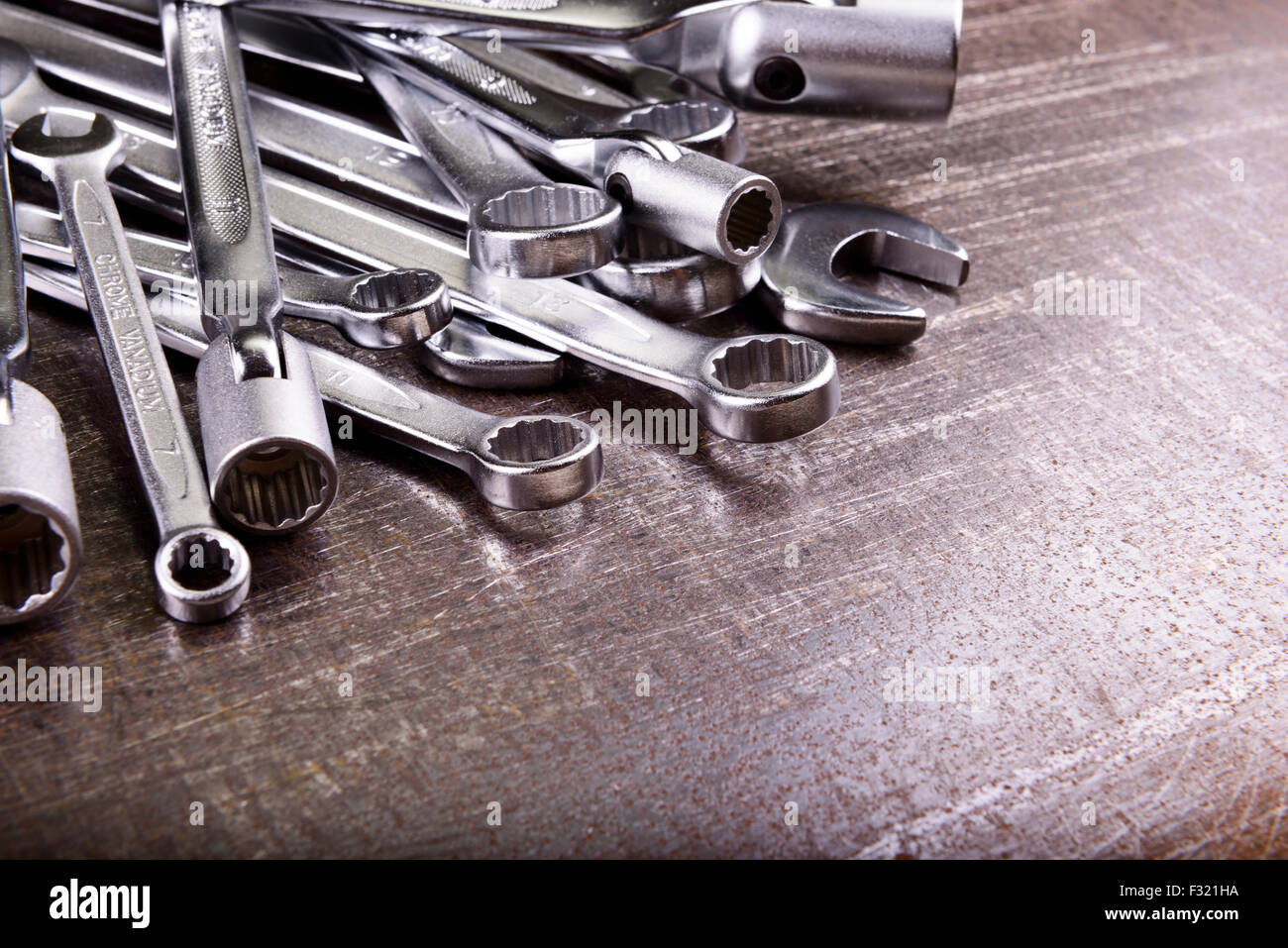 wrenches on a metal background Stock Photo - Alamy