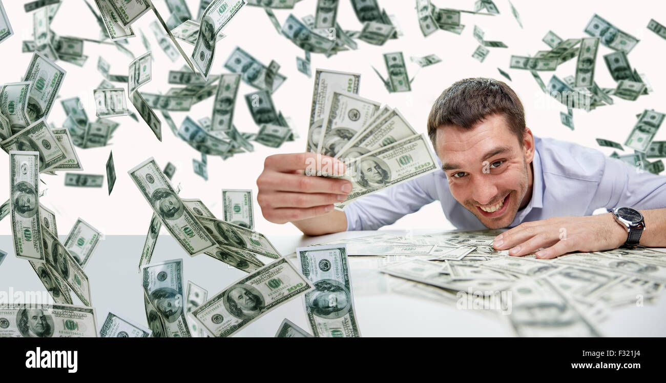 happy businessman with heap of money Stock Photo - Alamy