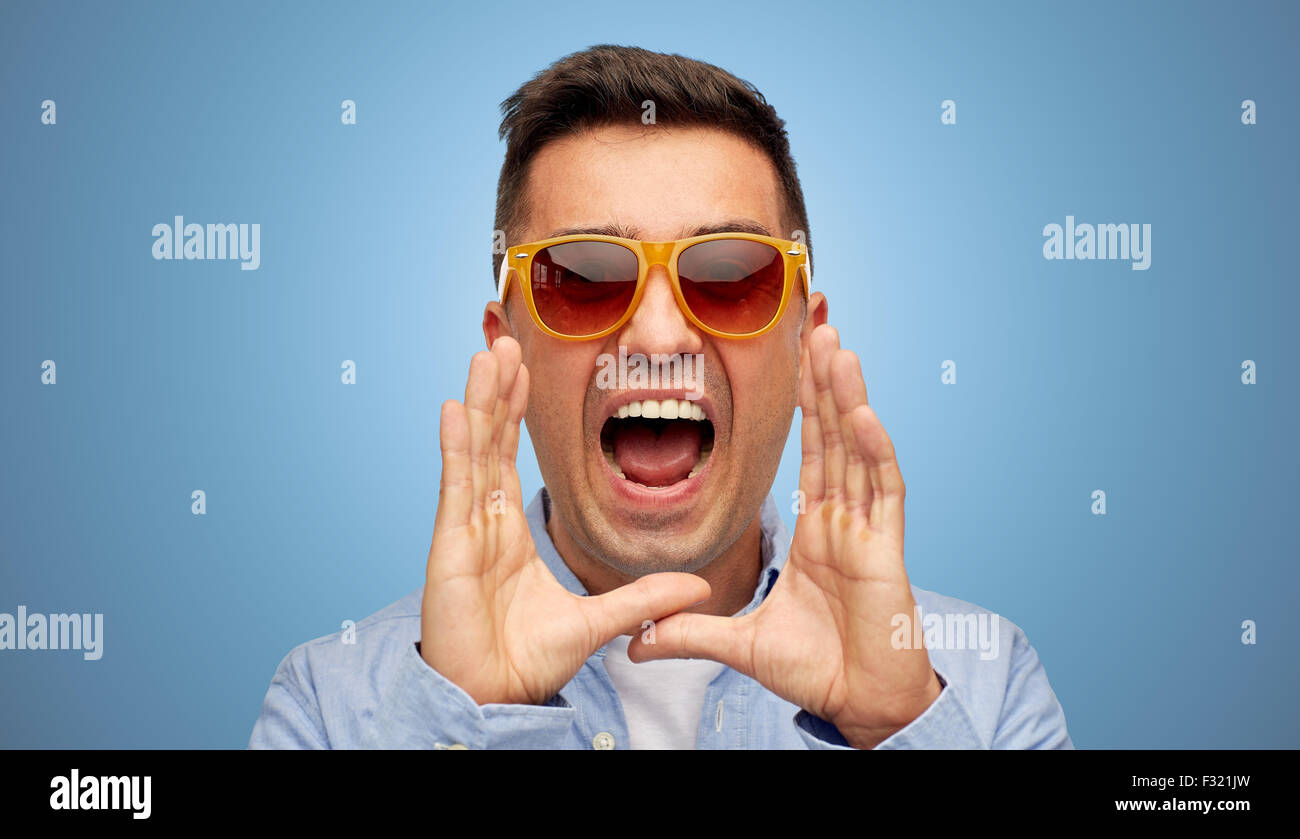 face of angry shouting man in shirt and sunglasses Stock Photo - Alamy