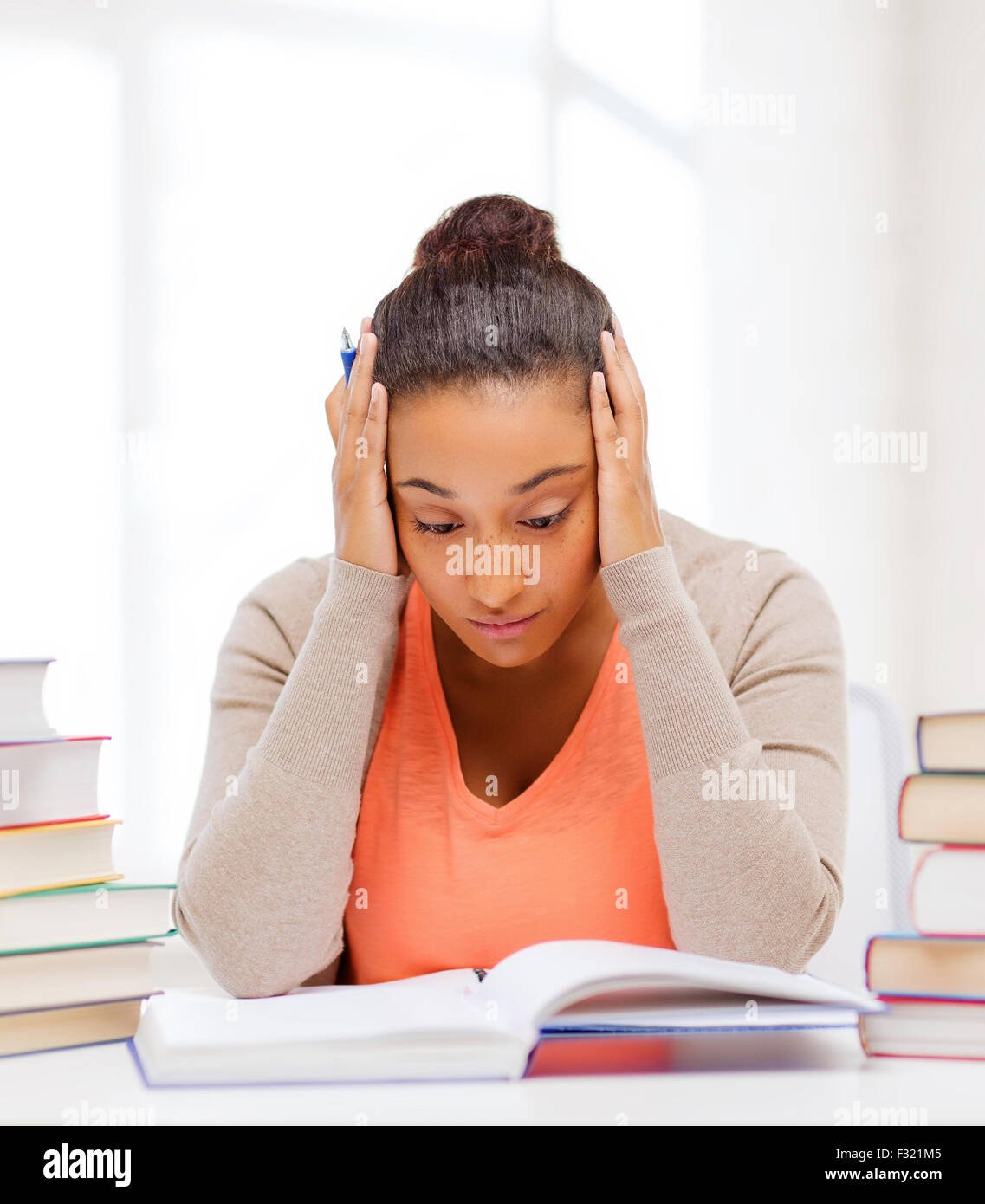 tired student with books and notes Stock Photo - Alamy