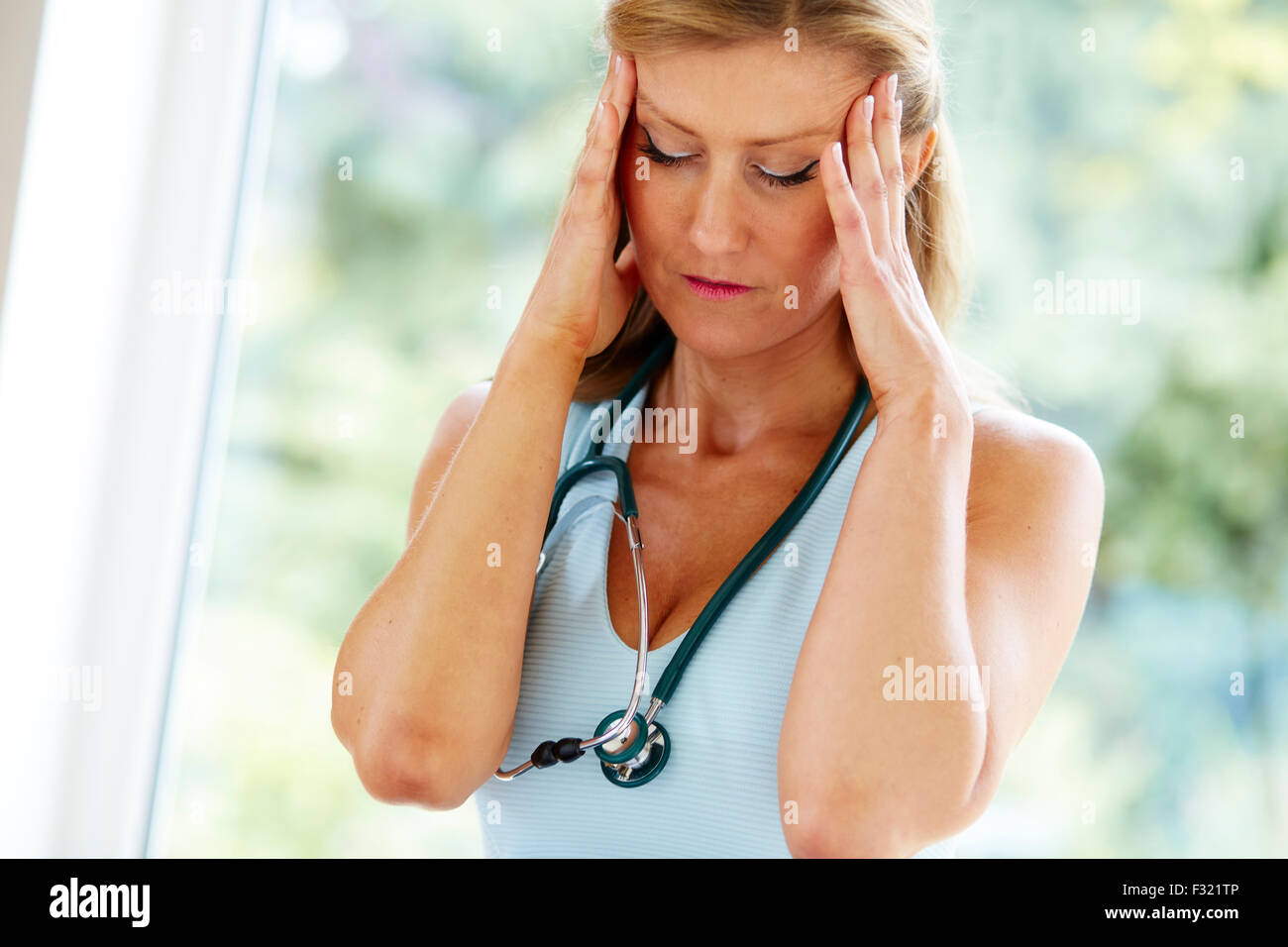 Nhs doctor patient sad hi-res stock photography and images - Alamy