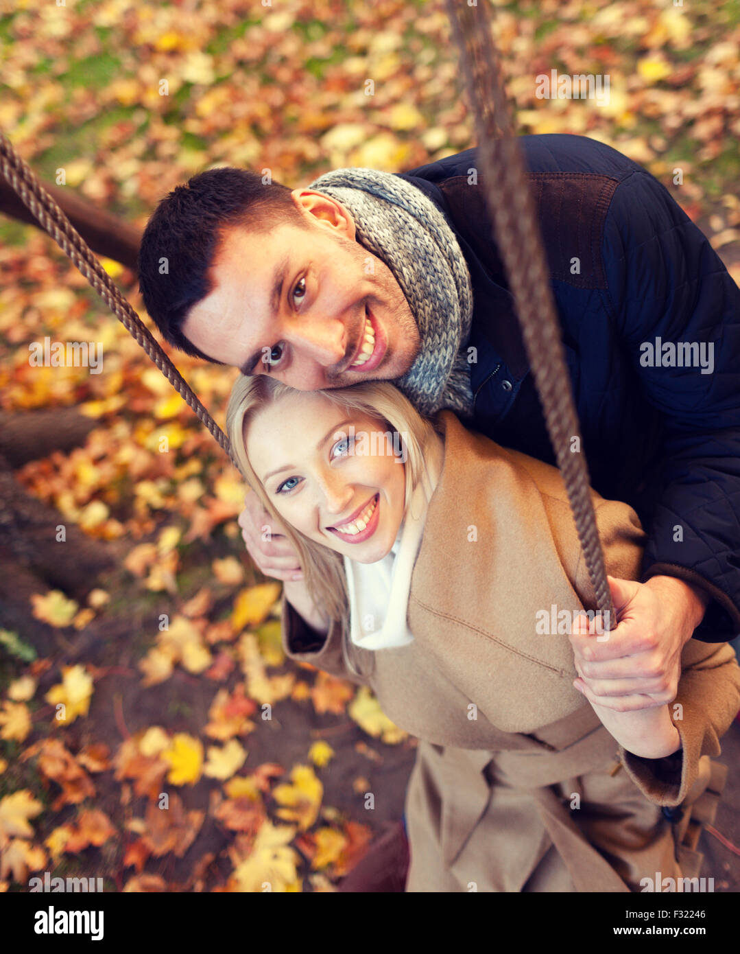 smiling couple hugging in autumn park Stock Photo - Alamy