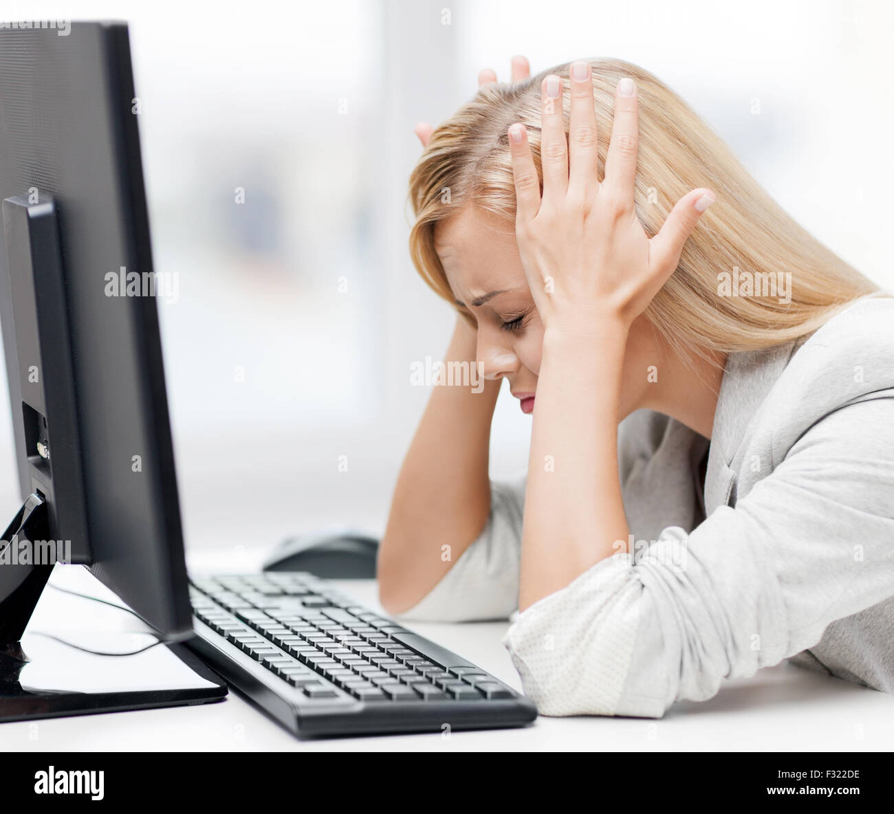stressed woman with computer Stock Photo - Alamy