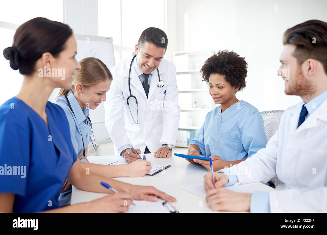 group of happy doctors meeting at hospital office Stock Photo - Alamy