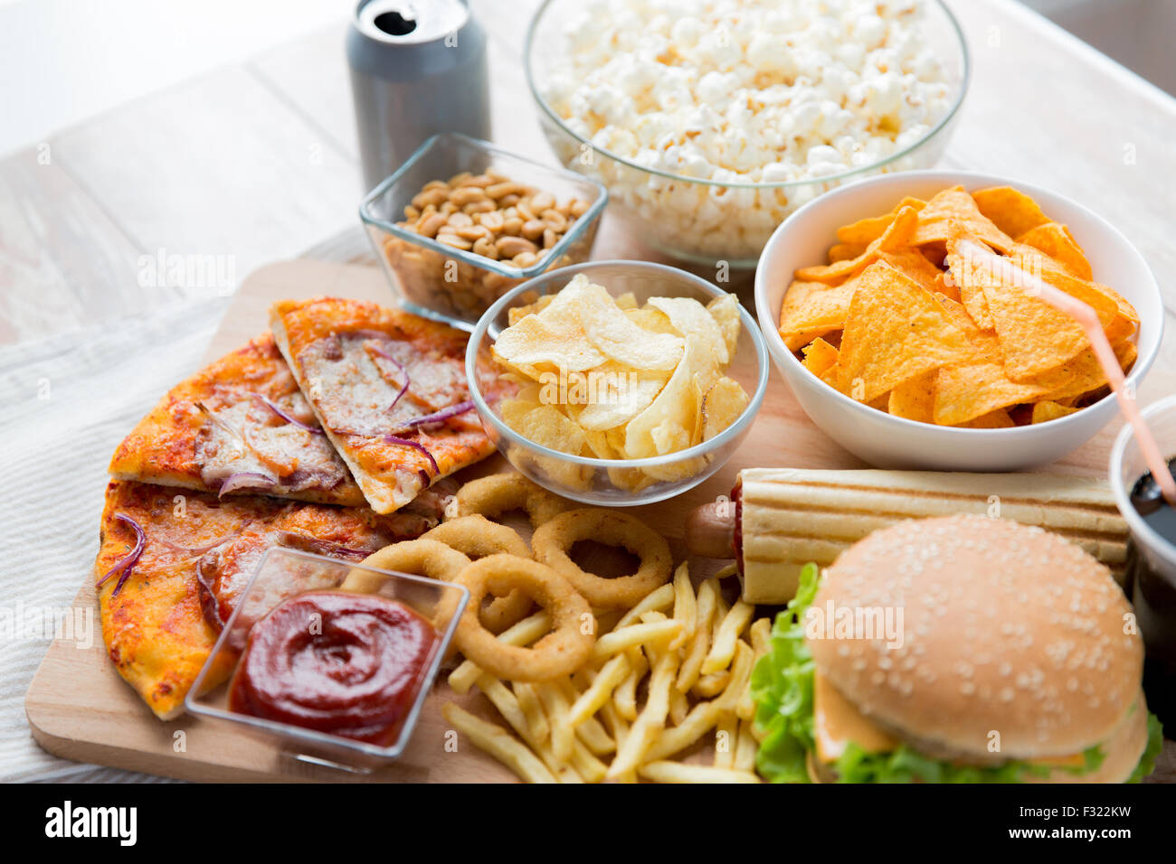 close up of fast food snacks and drink on table Stock Photo - Alamy