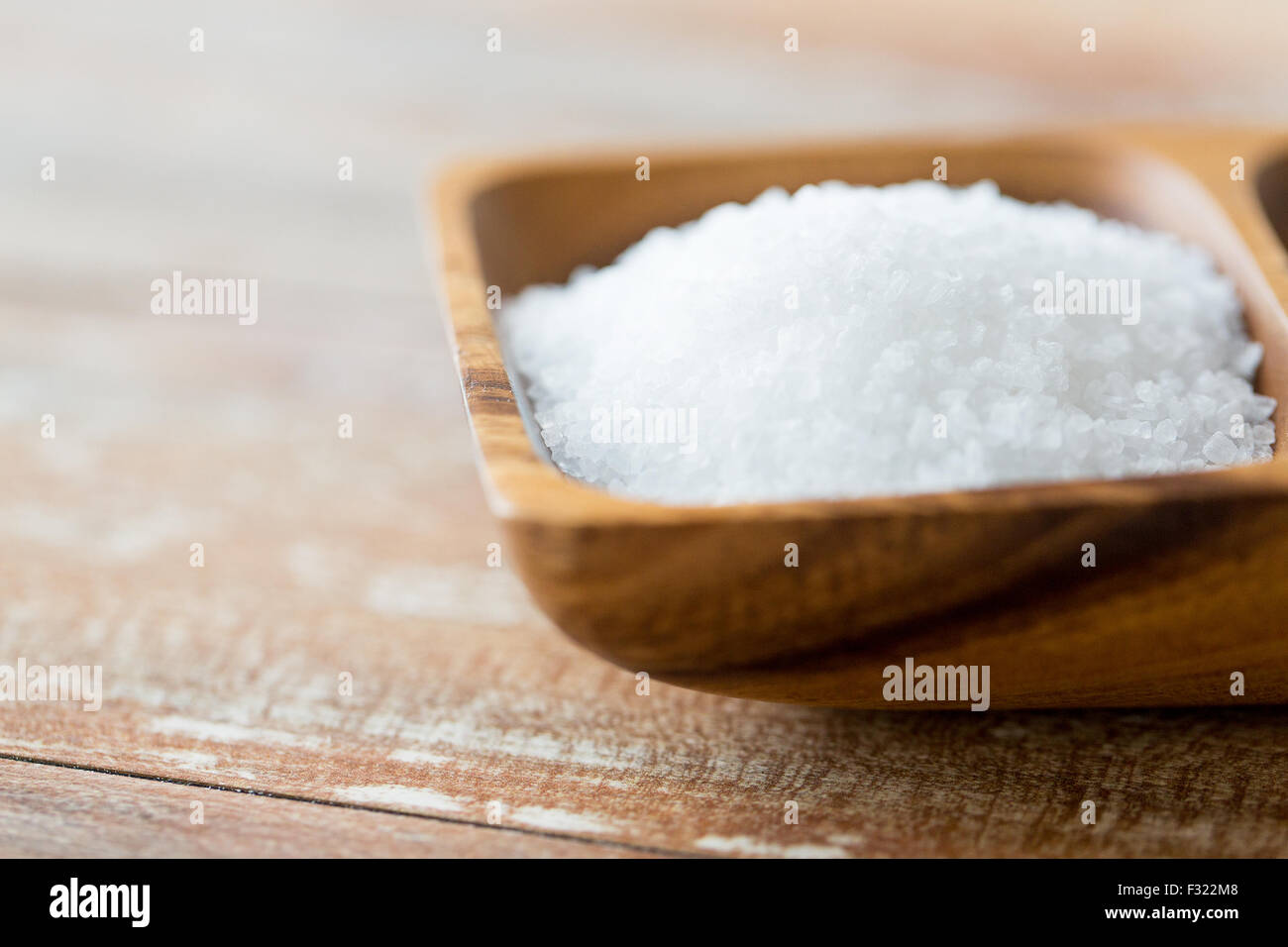 close up of white salt heap in wooden bowl Stock Photo - Alamy