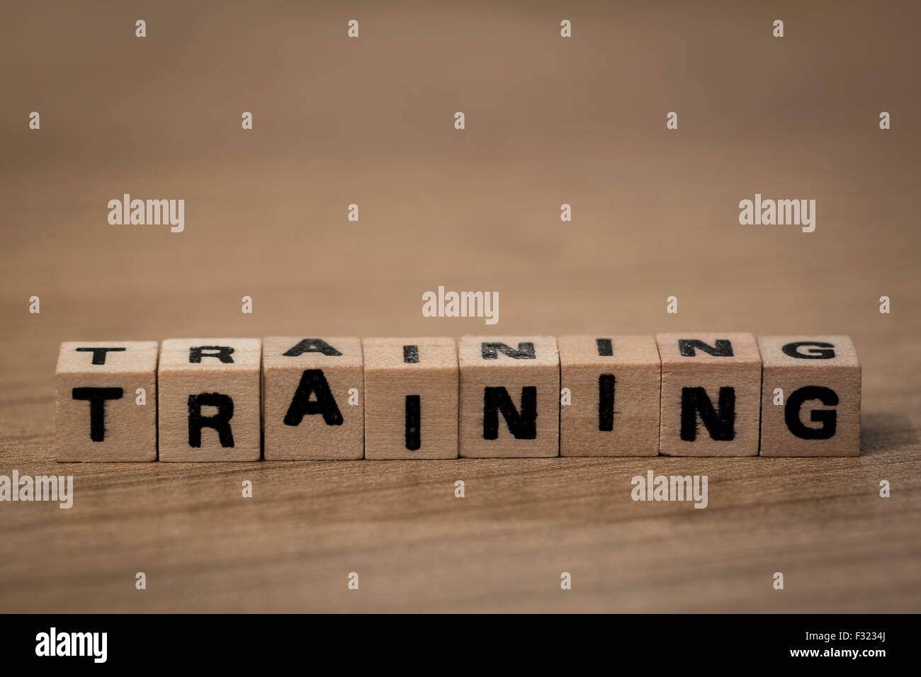 training written in wooden cubes on a desk Stock Photo - Alamy