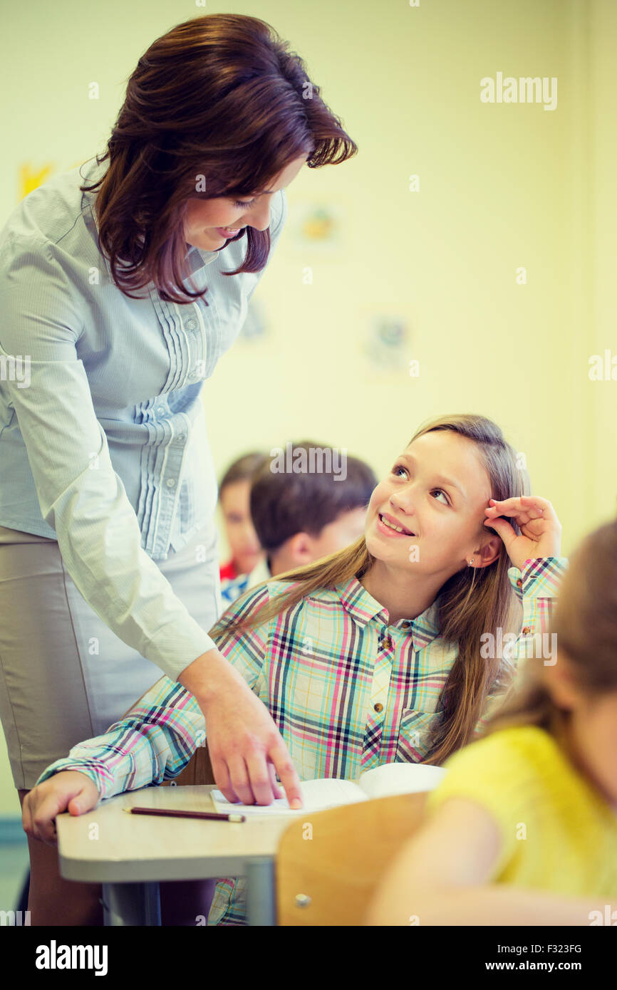 group of school kids writing test in classroom Stock Photo - Alamy