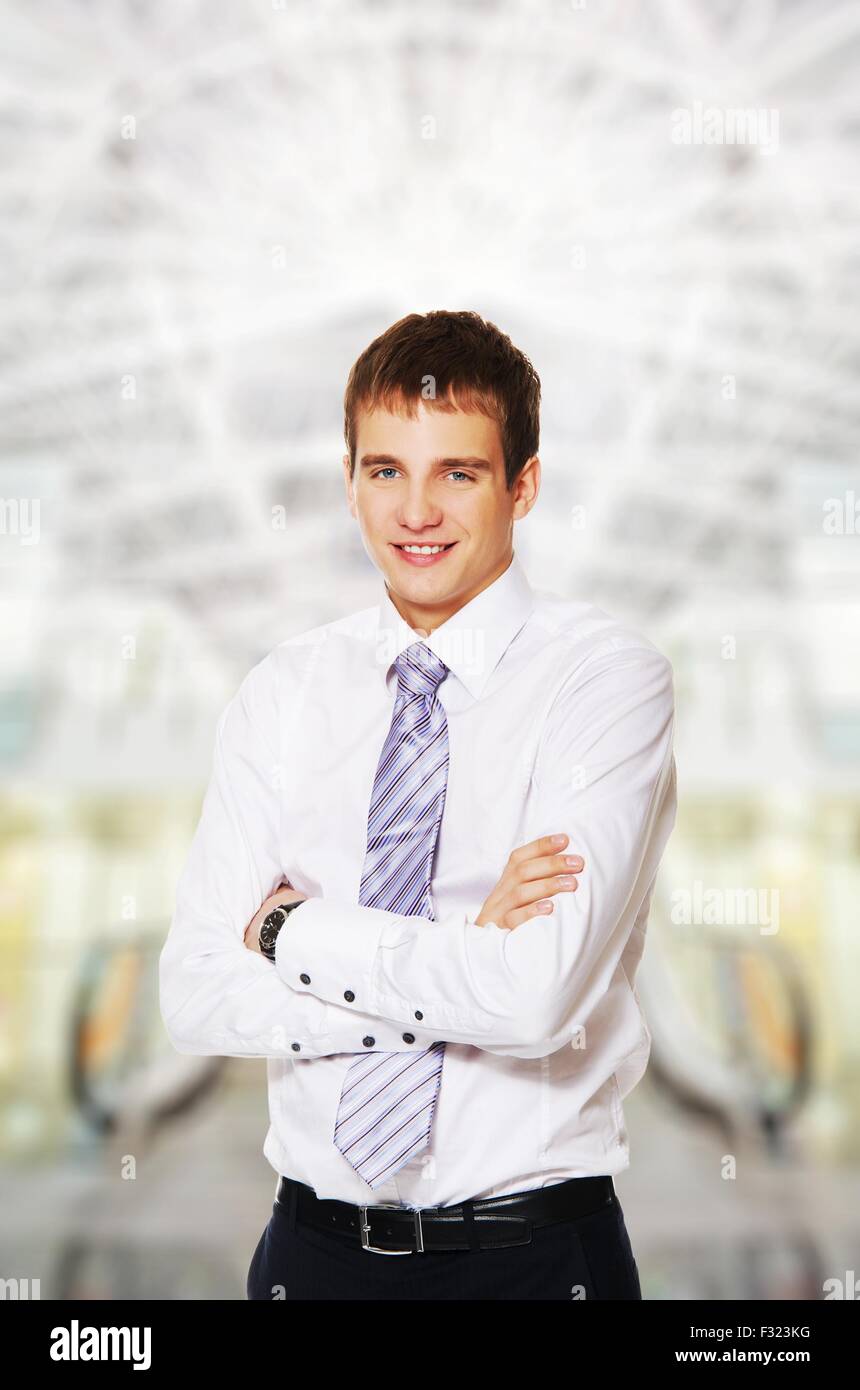 Young happy businessman Stock Photo - Alamy