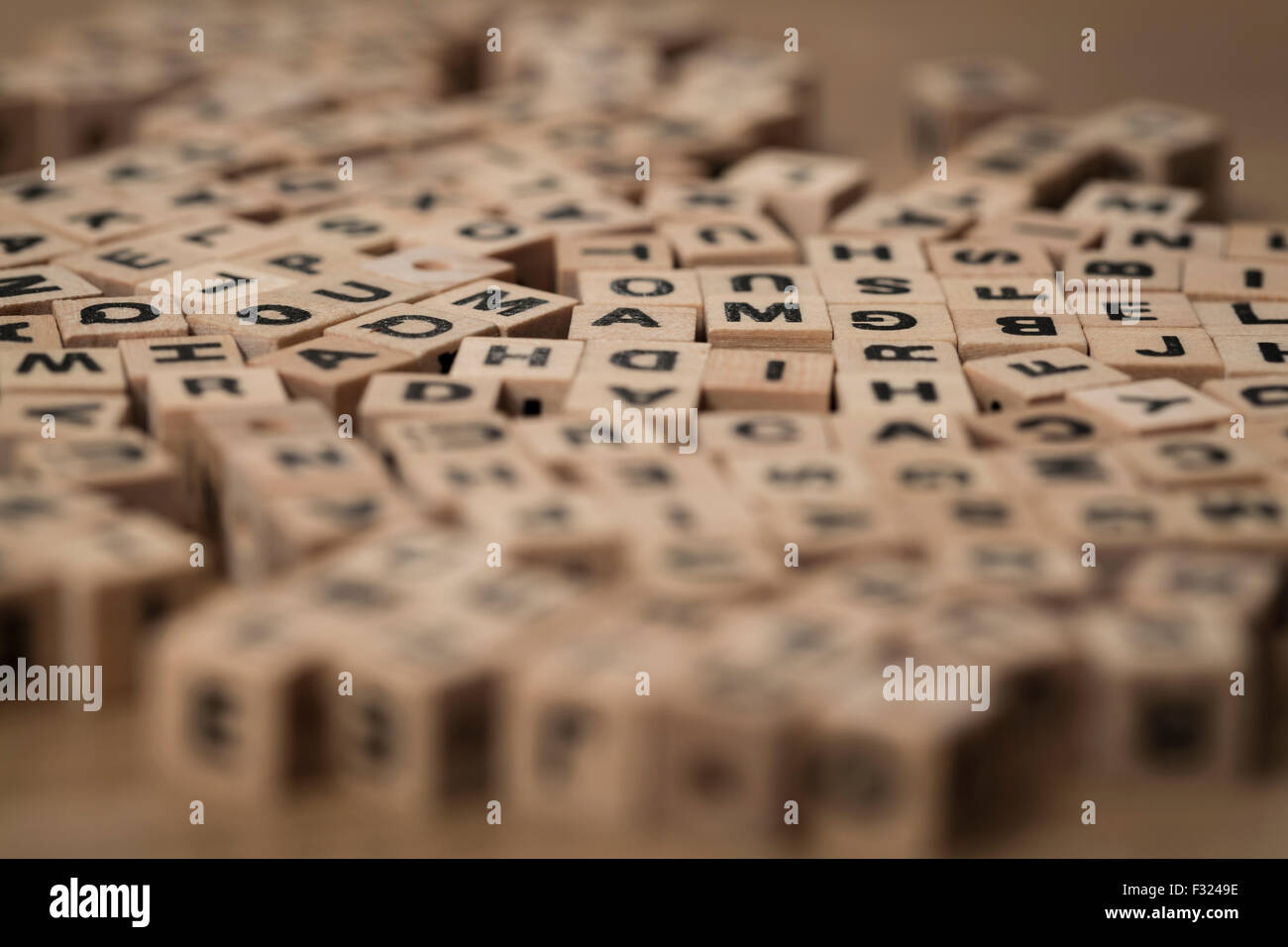 small wooden cubes messily on a desk Stock Photo - Alamy