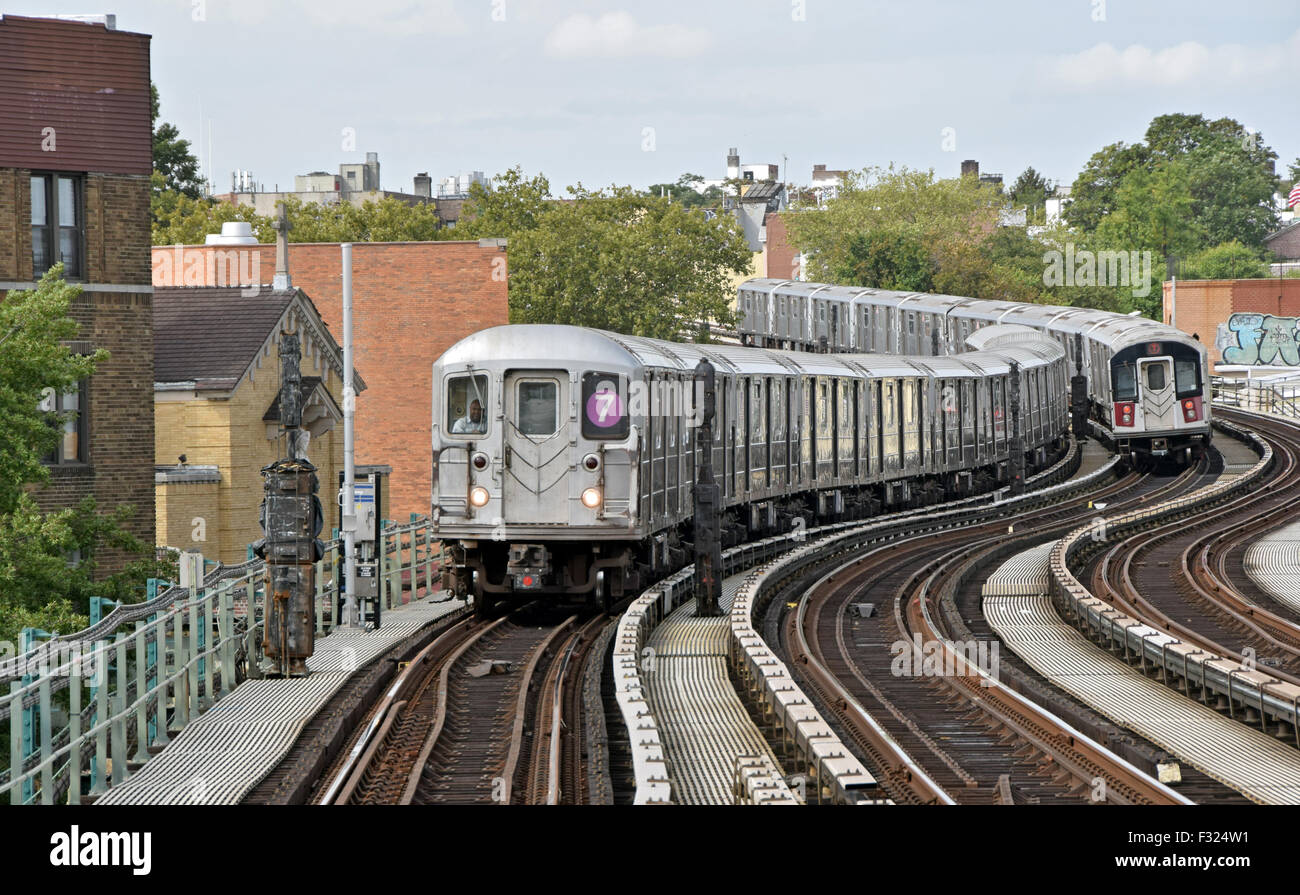 A view of two elevated subway trains from the 61st street station of ...