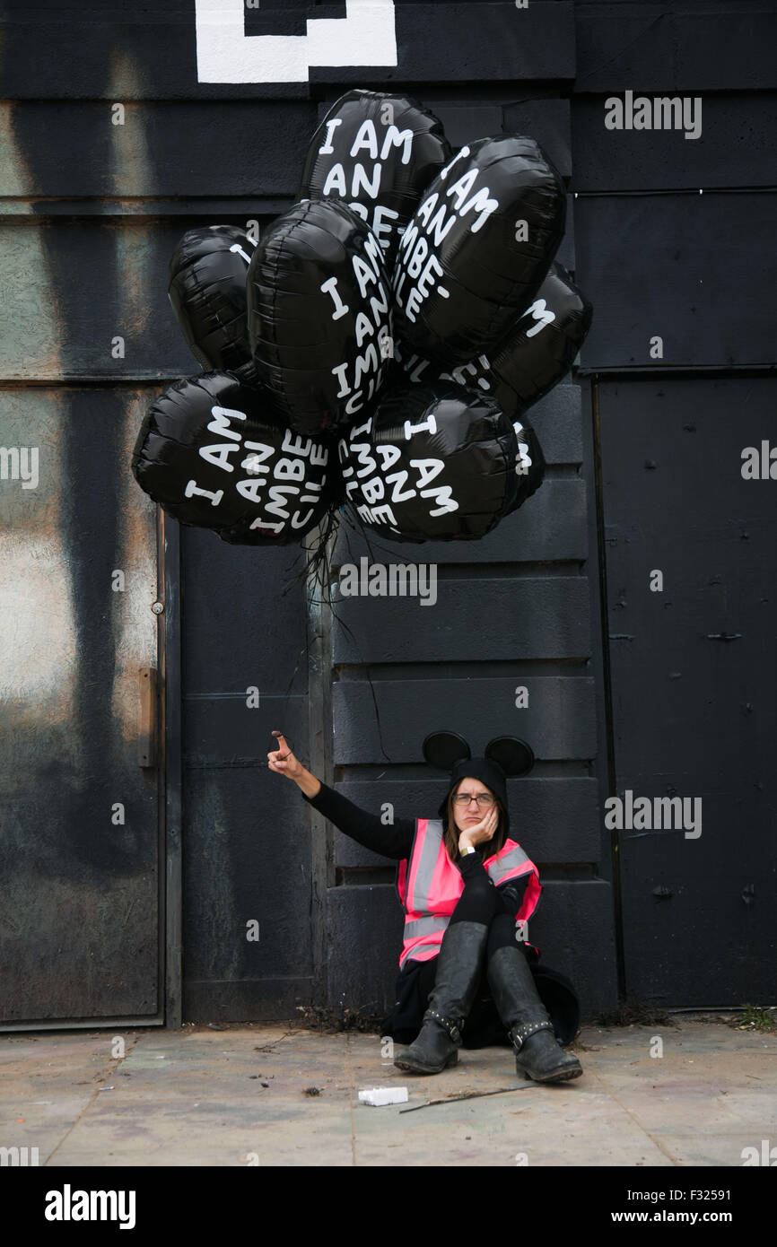 A very tired and grumpy park attendant with souvenir balloons by David ...