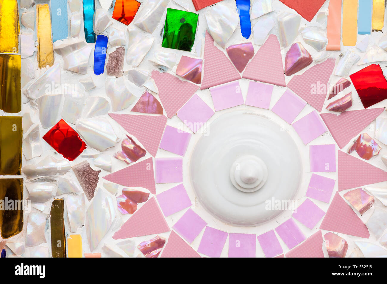 on this wall there are small pieces of tiles Stock Photo - Alamy