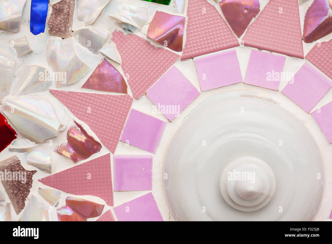 on this wall there are small pieces of tiles Stock Photo - Alamy