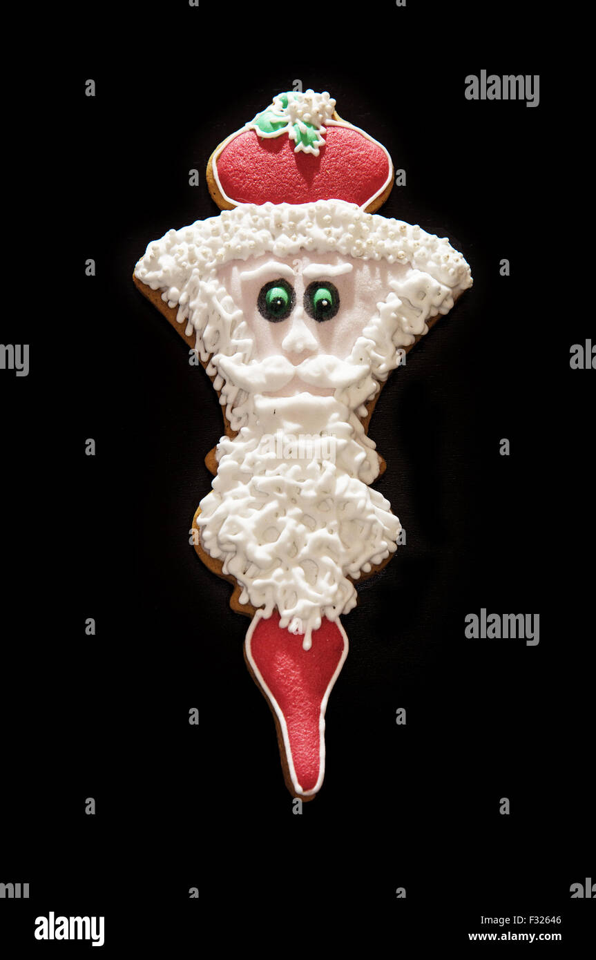 Tasty gingerbread Santa Claus on the dark background. Christmas theme ...