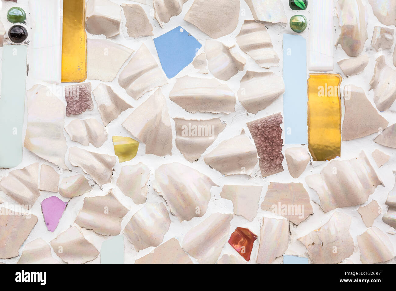 on this wall there are small pieces of tiles Stock Photo - Alamy
