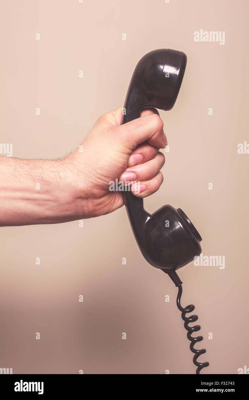 Hand holding receiver hi-res stock photography and images - Alamy