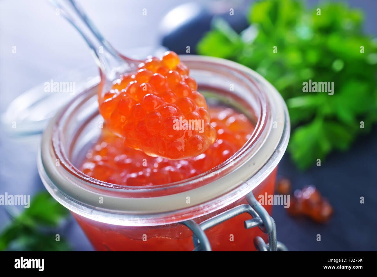 red salmon caviar in glass bank and on a table Stock Photo - Alamy