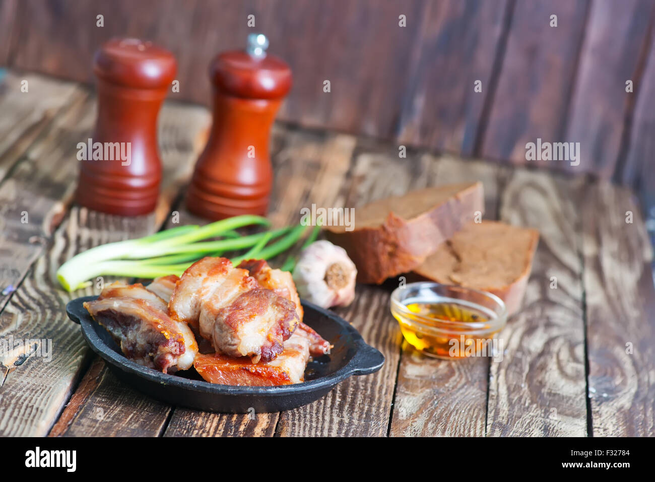 fried meat on plate and on a table Stock Photo - Alamy