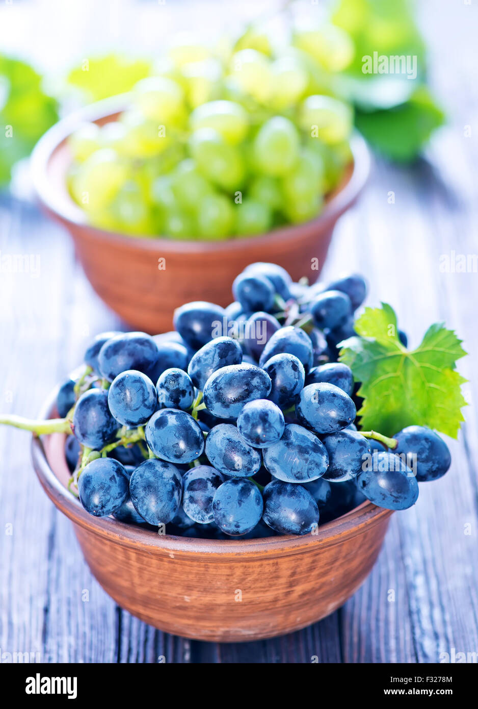 fresh grape on plate and on a table Stock Photo - Alamy
